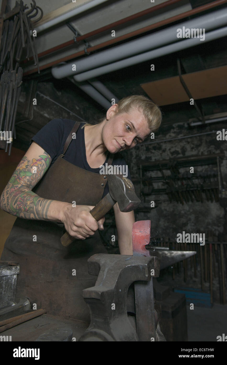 Woman blacksmith working in forge hi-res stock photography and images ...