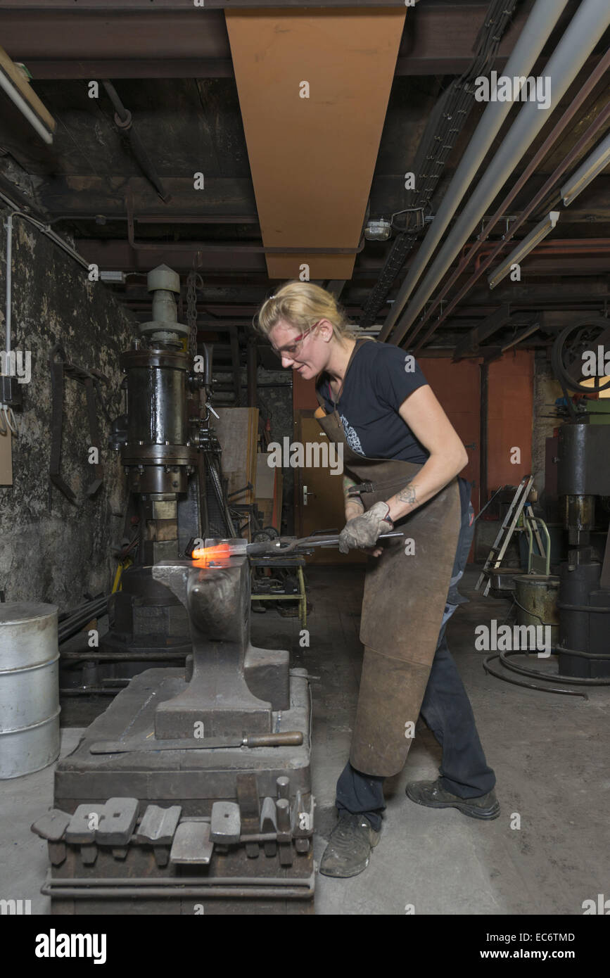 Woman blacksmith working in forge hi-res stock photography and images ...