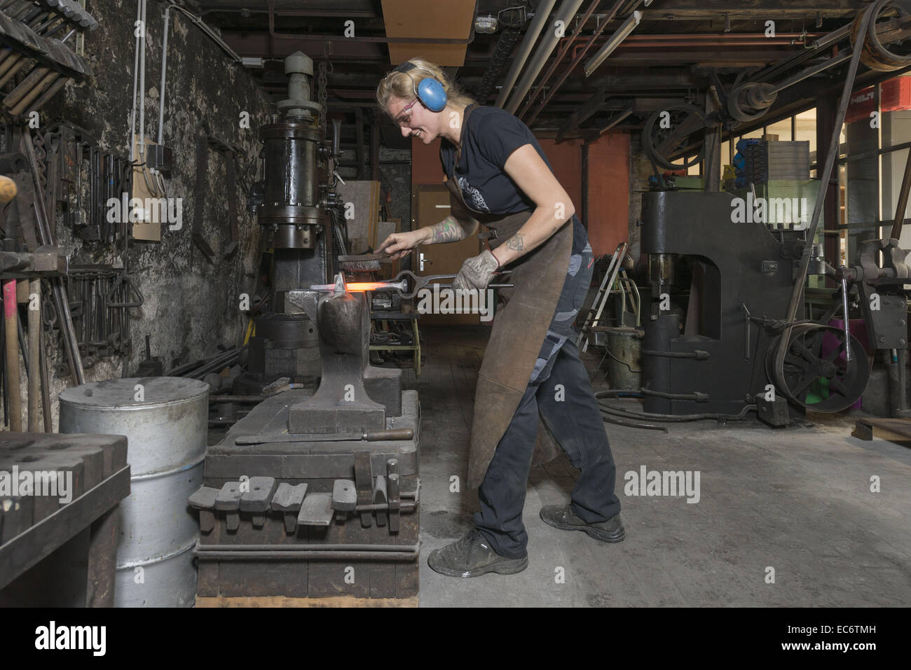 Woman blacksmith working in forge hi-res stock photography and images ...