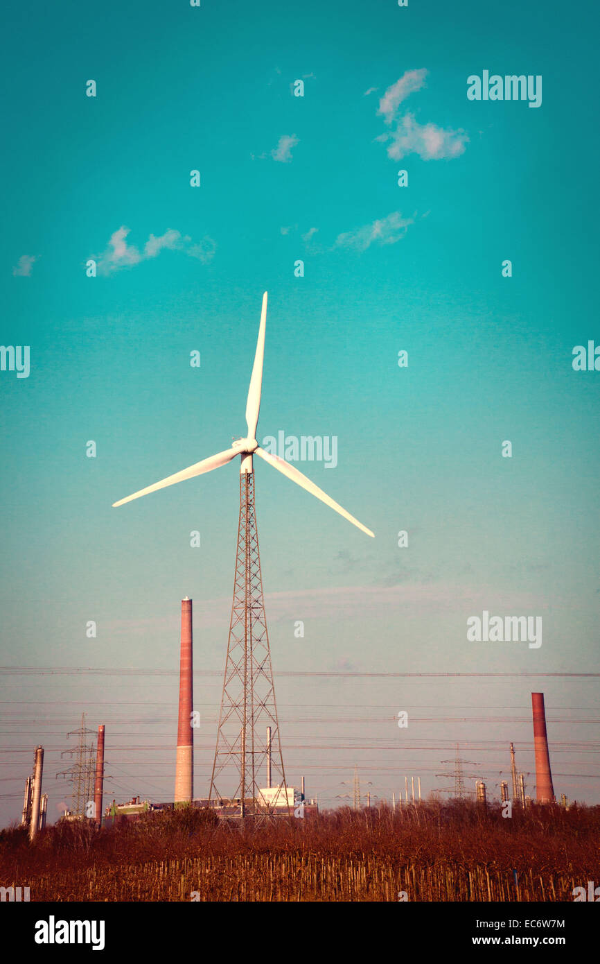 Wind turbine wind turbine with industrial chimneys in the background ...