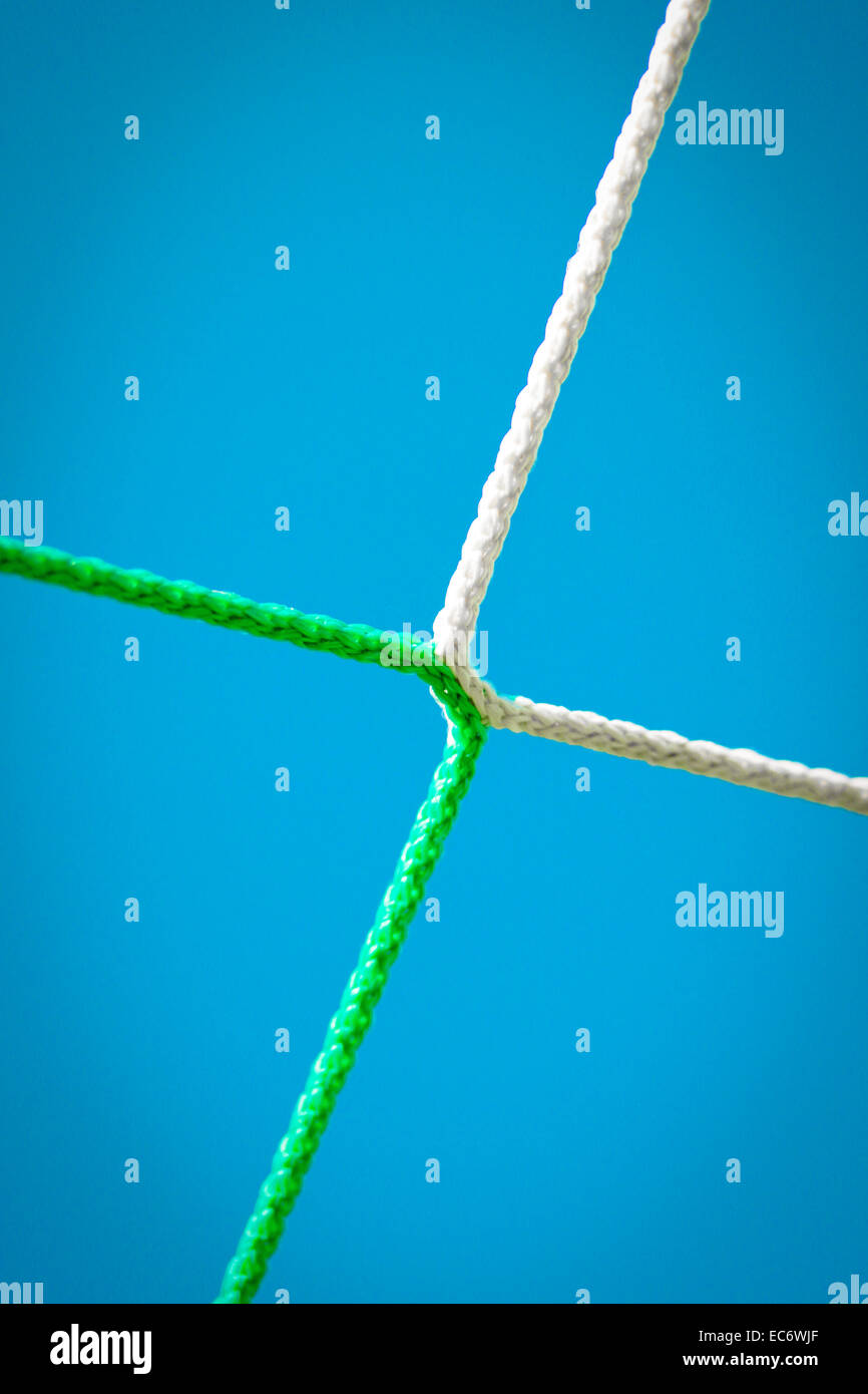 Combination of two different colored ropes against blue background ...