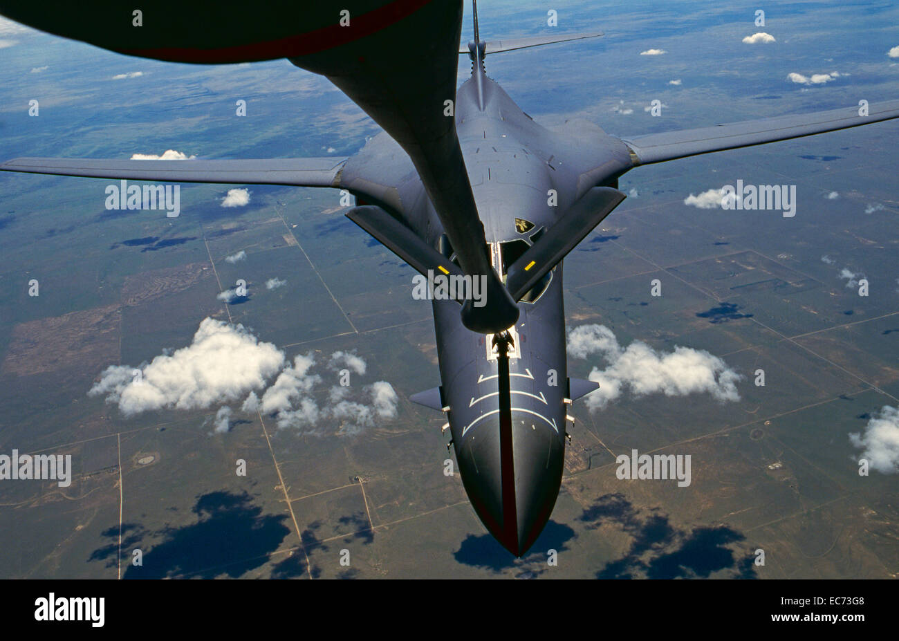 A B-1 bomber takes on fuel from an airborne KC-130 tanker over Eastern ...