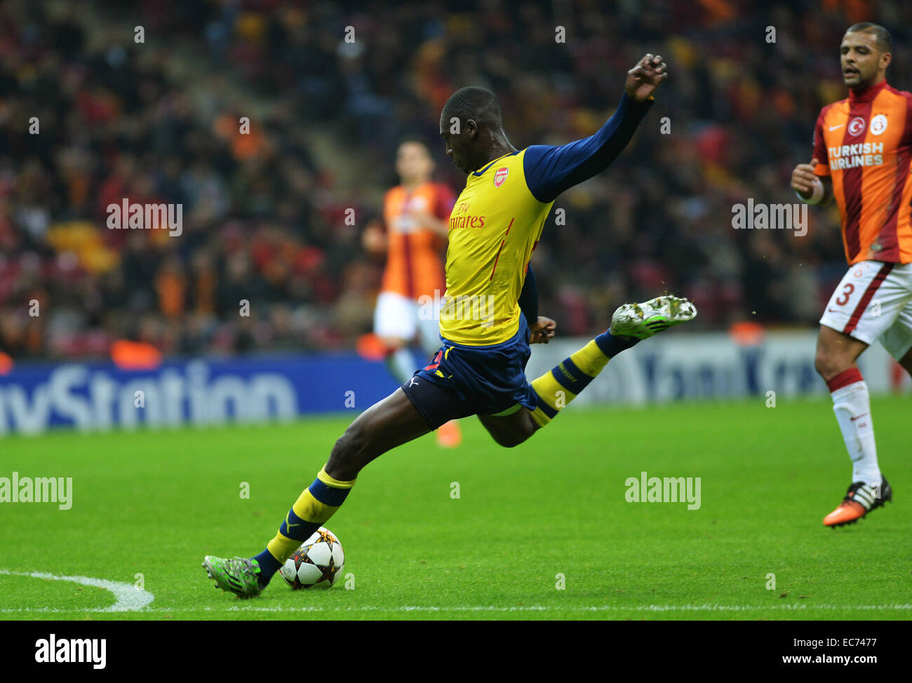 Istanbul, Turkey. 9th Dec, 2014. Arsenal's Yaya Sanogo (L) shoots ...