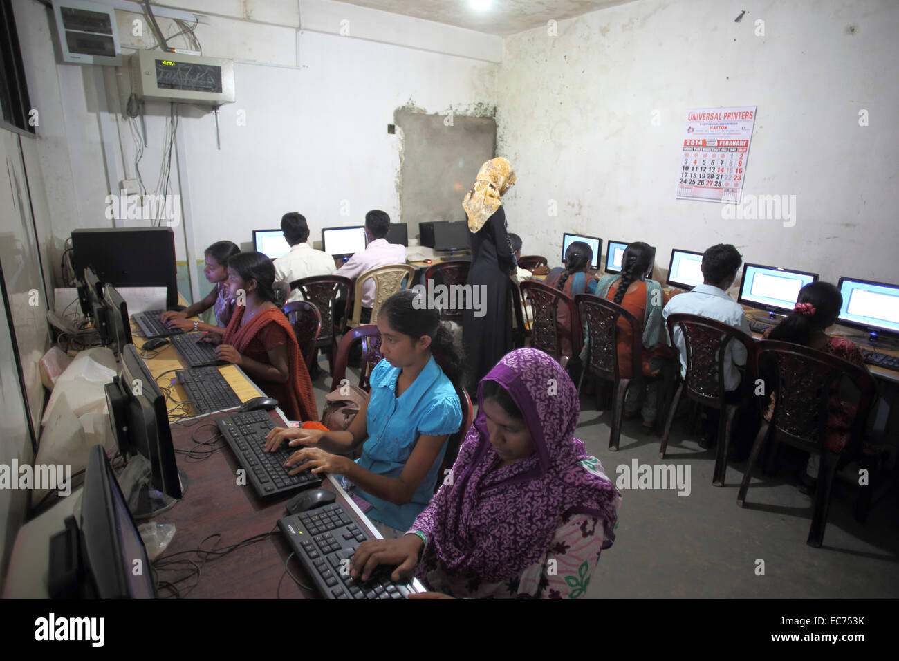 Students learning computer skills at the Tea Leaf Vision school in ...