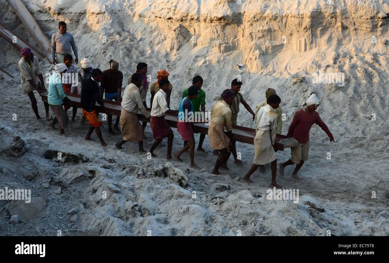 Worker carrying iron guarder to make a temoprary bridge on the river ...