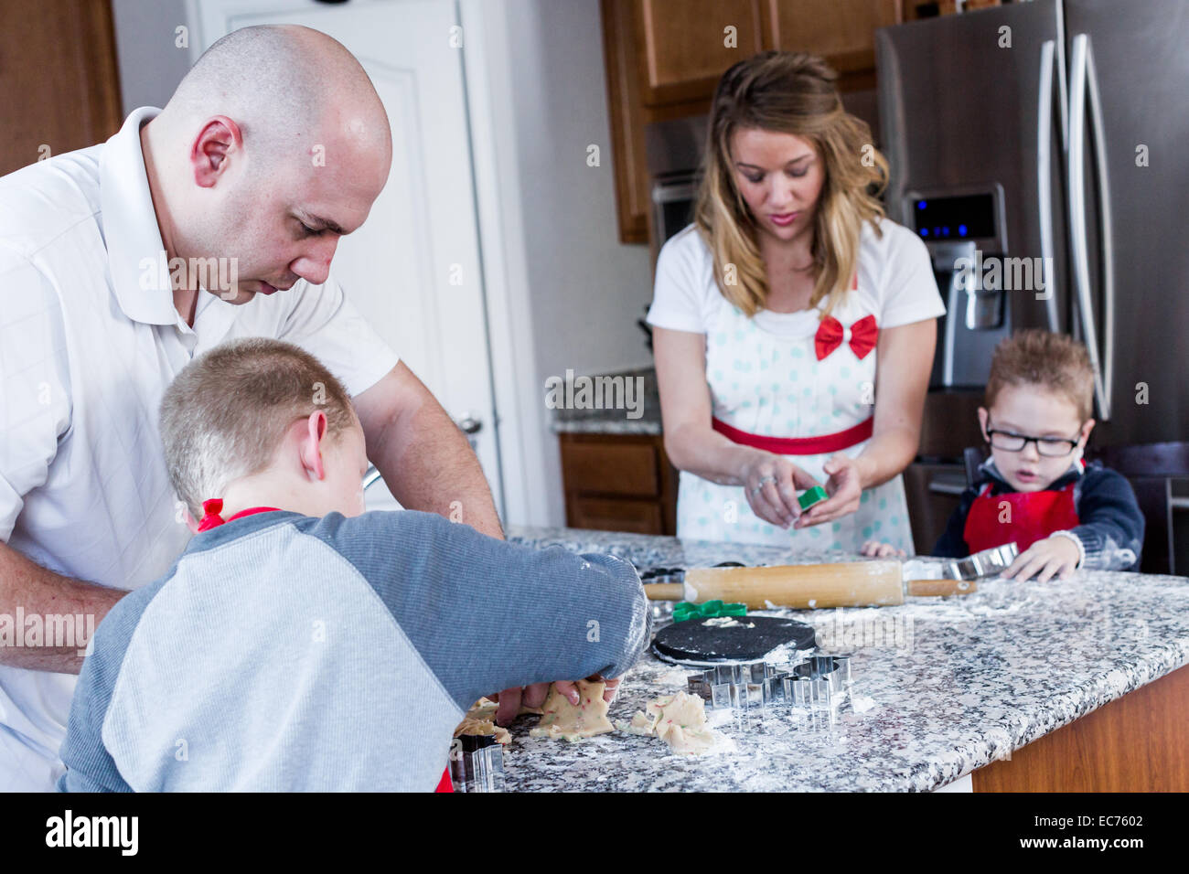 Making cookies with family for Christmas Stock Photo - Alamy