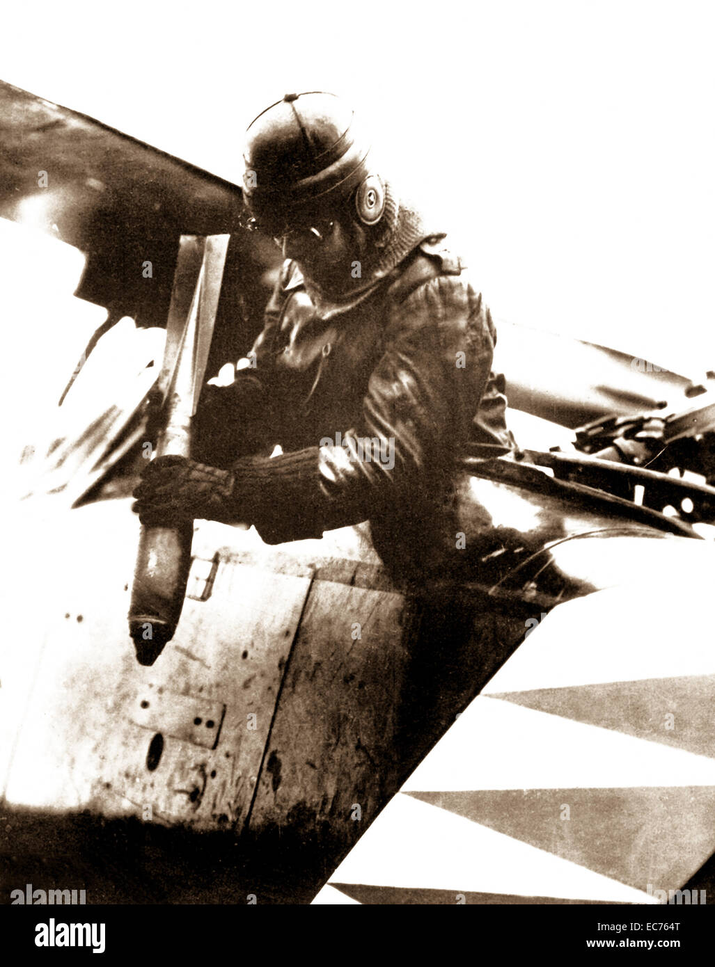 German aviator dropping a bomb somewhere on the western front. German ...