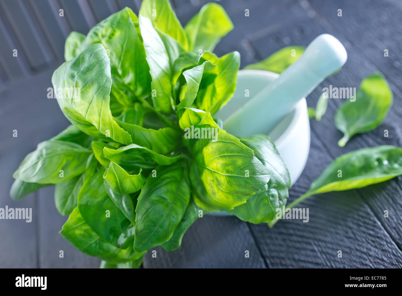 fresh basil in bowl and on a table Stock Photo - Alamy