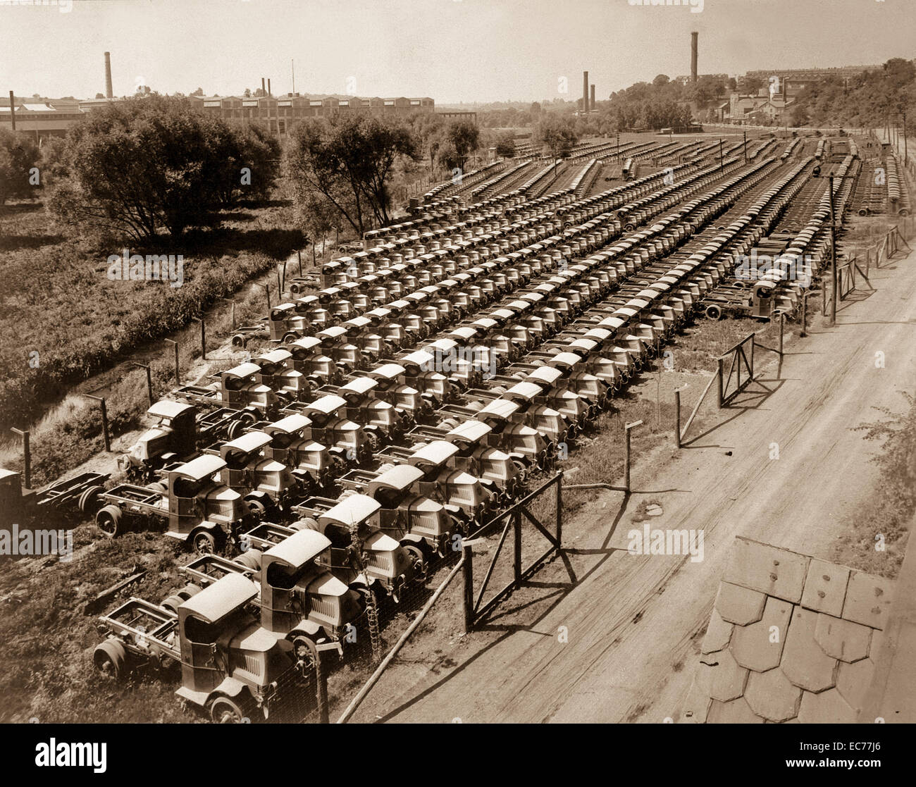 Lines of Mack war trucks, just off the assembly line, all for the war ...