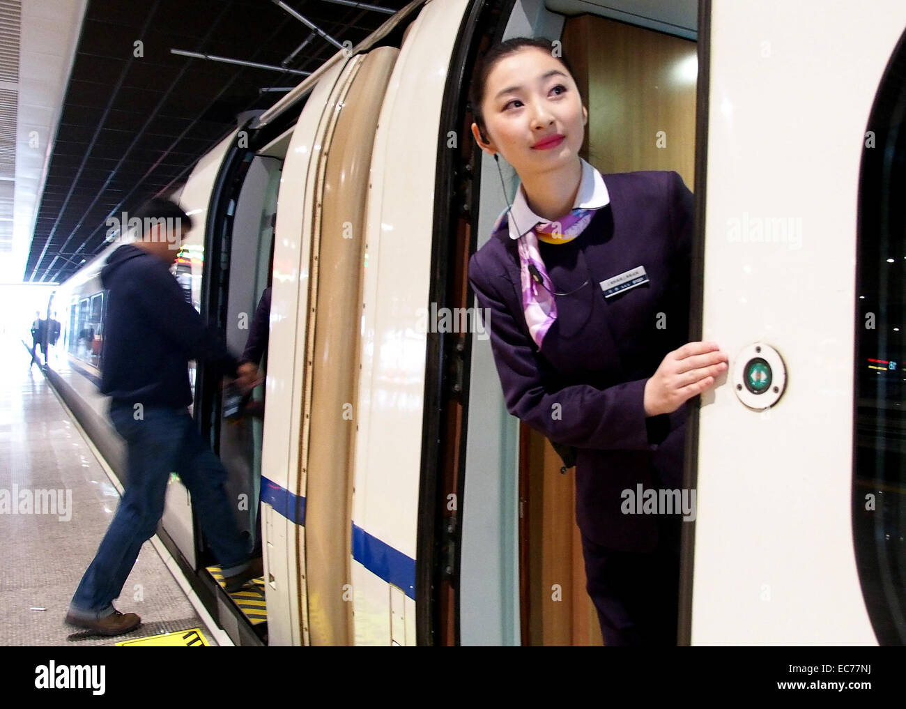Shanghai, China's Zhejiang Province. 10th Dec, 2014. A conductor looks ...