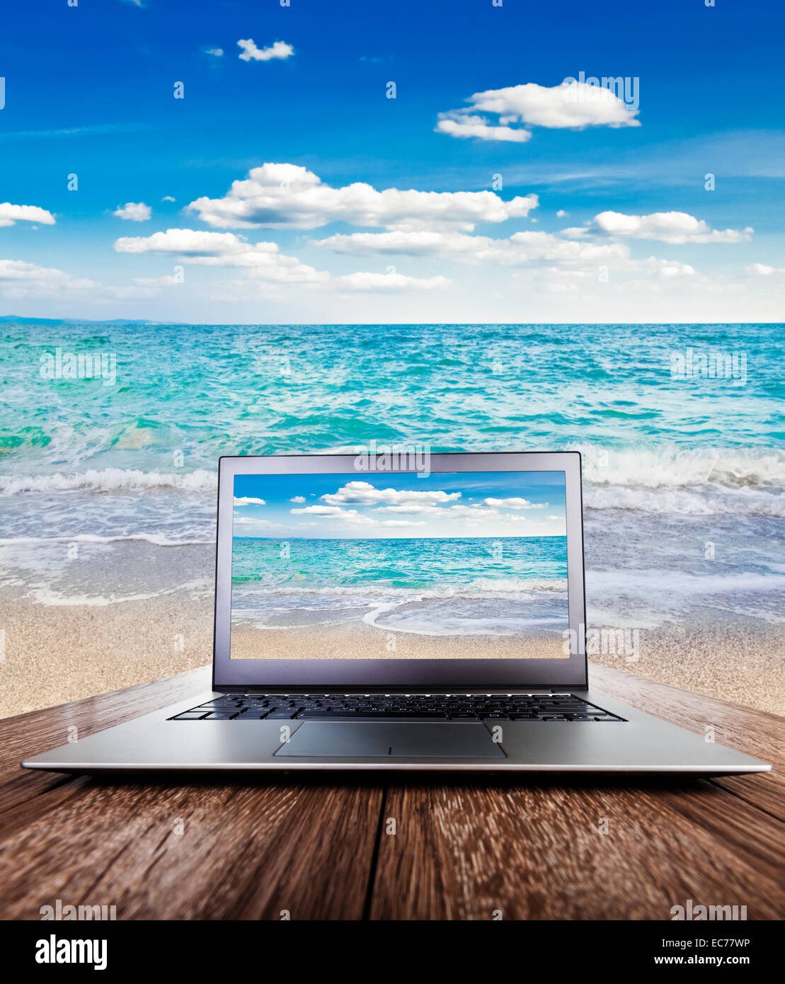 laptop over wooden table outdoors in sand beach Stock Photo - Alamy