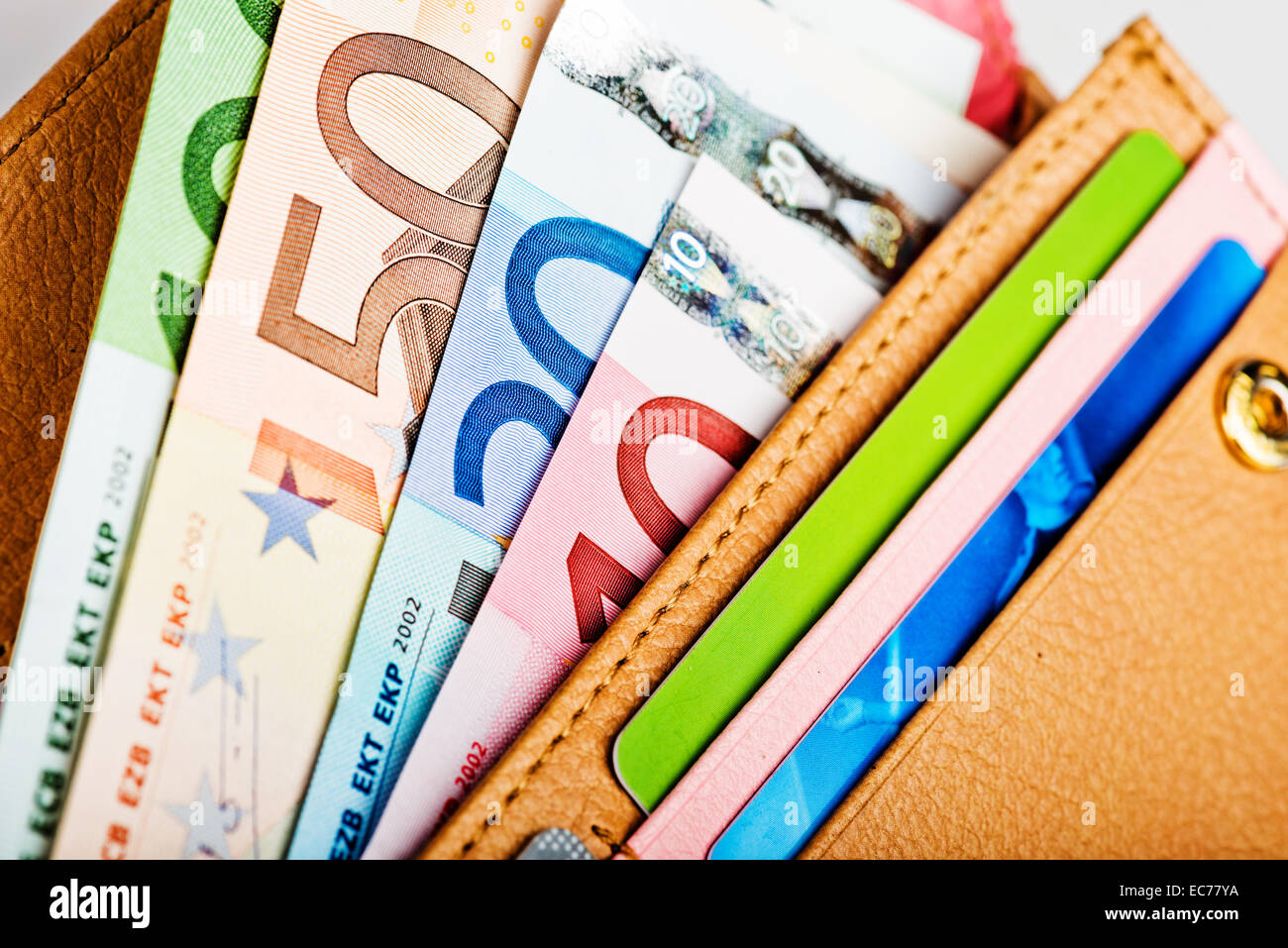 Money in wallet isolated on white background Stock Photo - Alamy