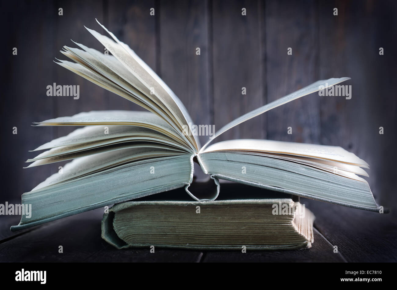 stack of old books on a table Stock Photo - Alamy