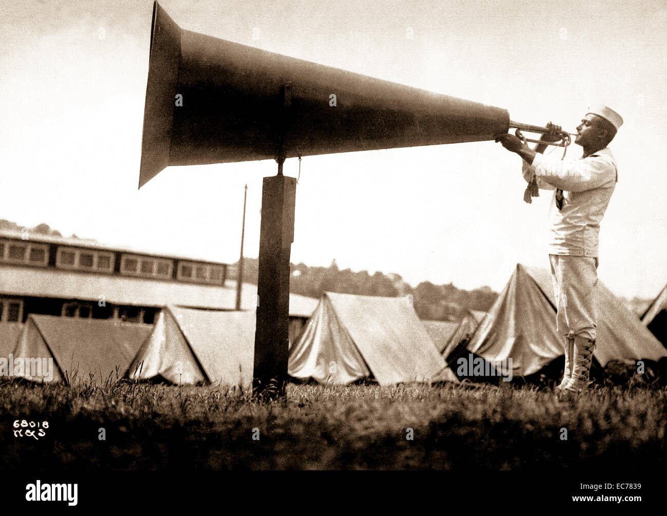 A bugler plays Reville through a giant megaphone at U.S.Naval Training ...