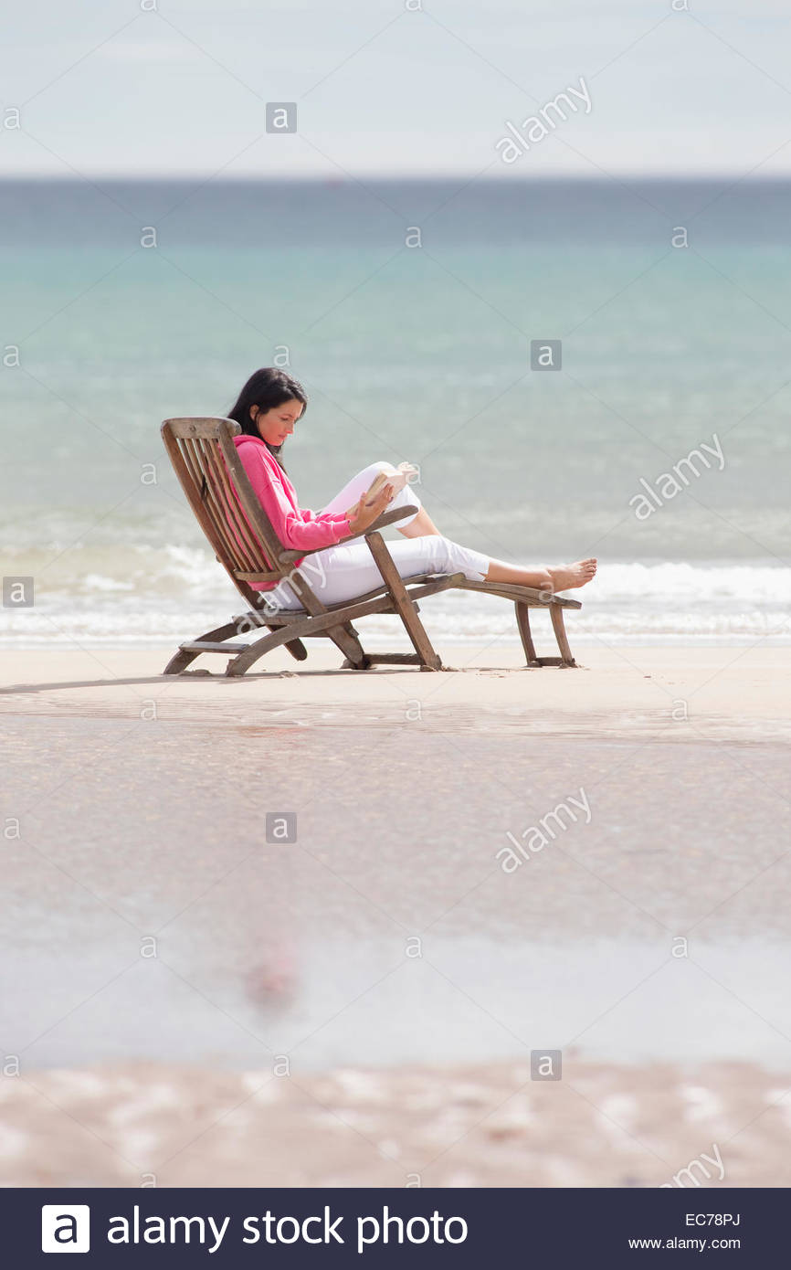 Woman Sitting In Beach Chair Stock Photos & Woman Sitting In Beach ...