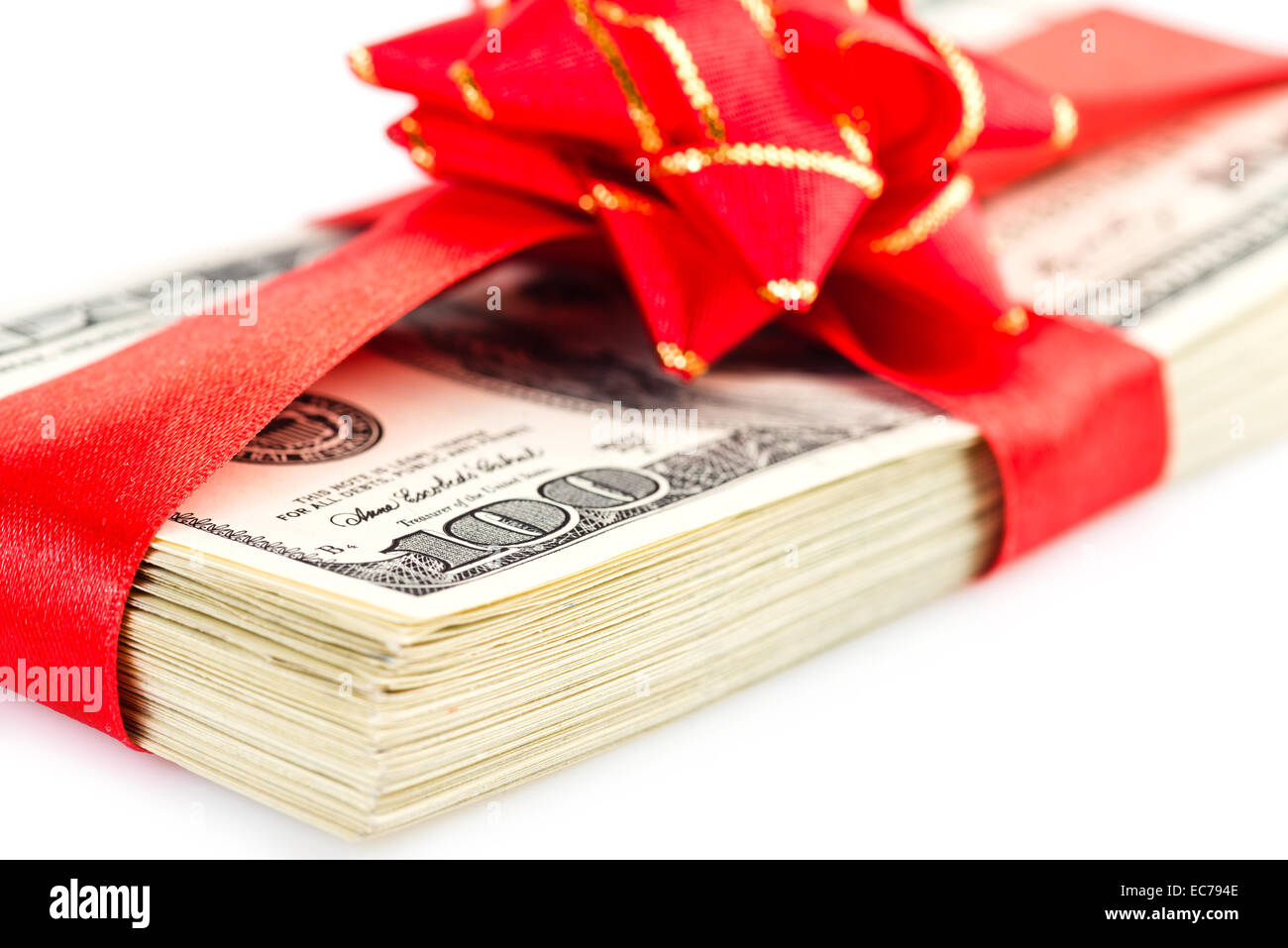 Money gift (big stack of dollars with red bow isolated on white ...