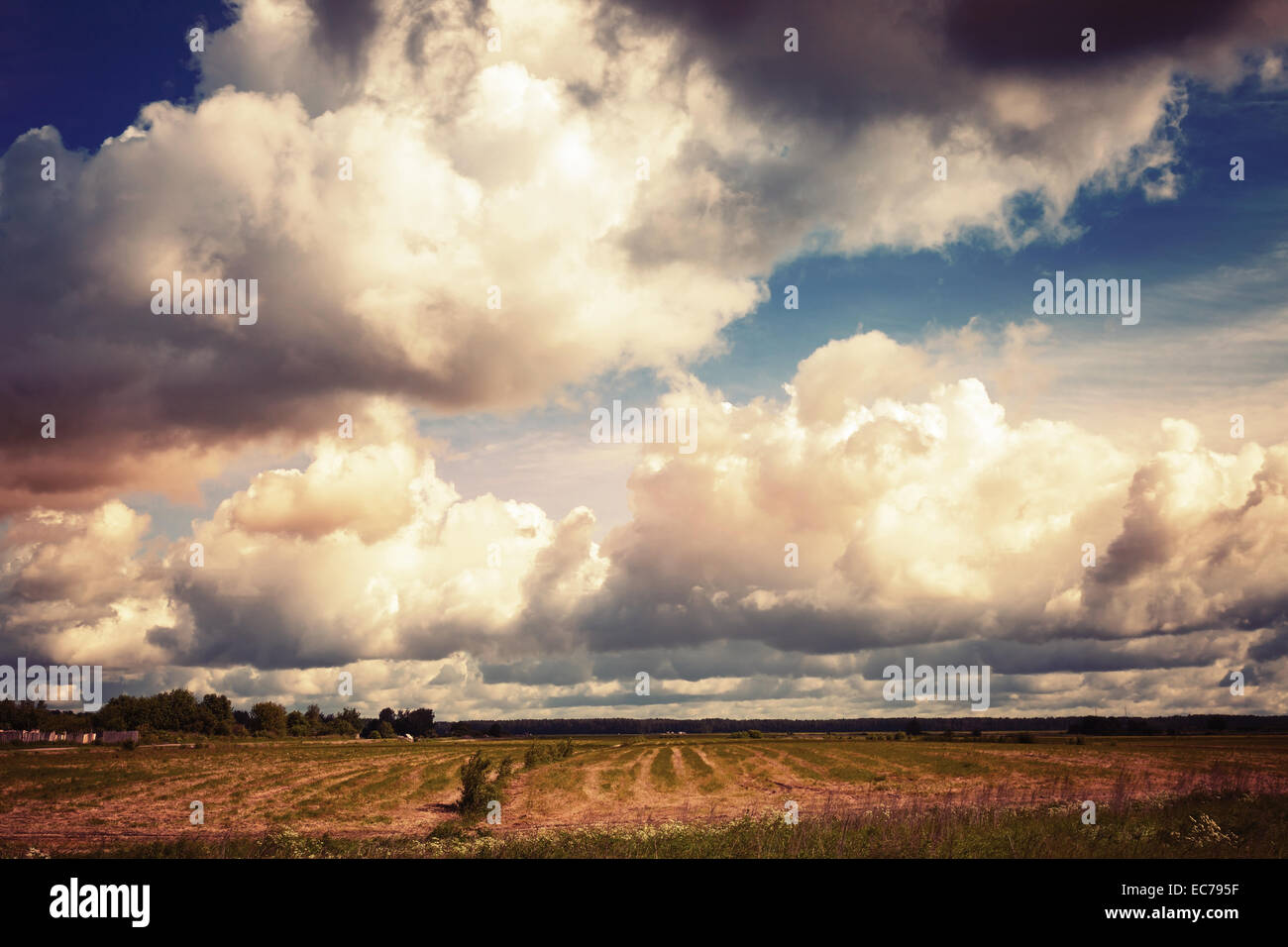 Empty country landscape with dramatic cloudy sky. Vintage toned photo ...