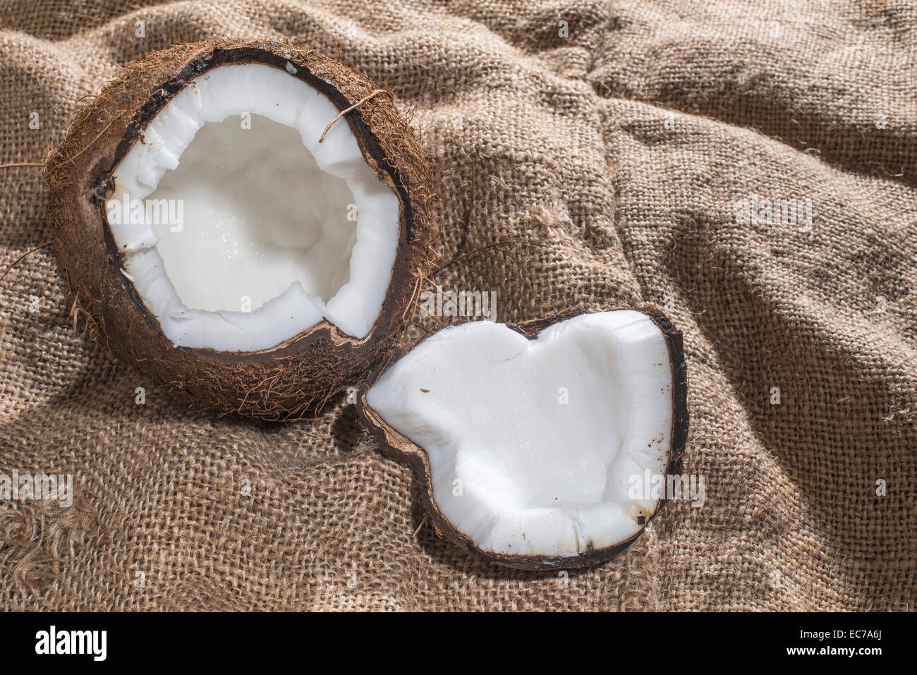 Coconut on burlap. Close up Stock Photo - Alamy