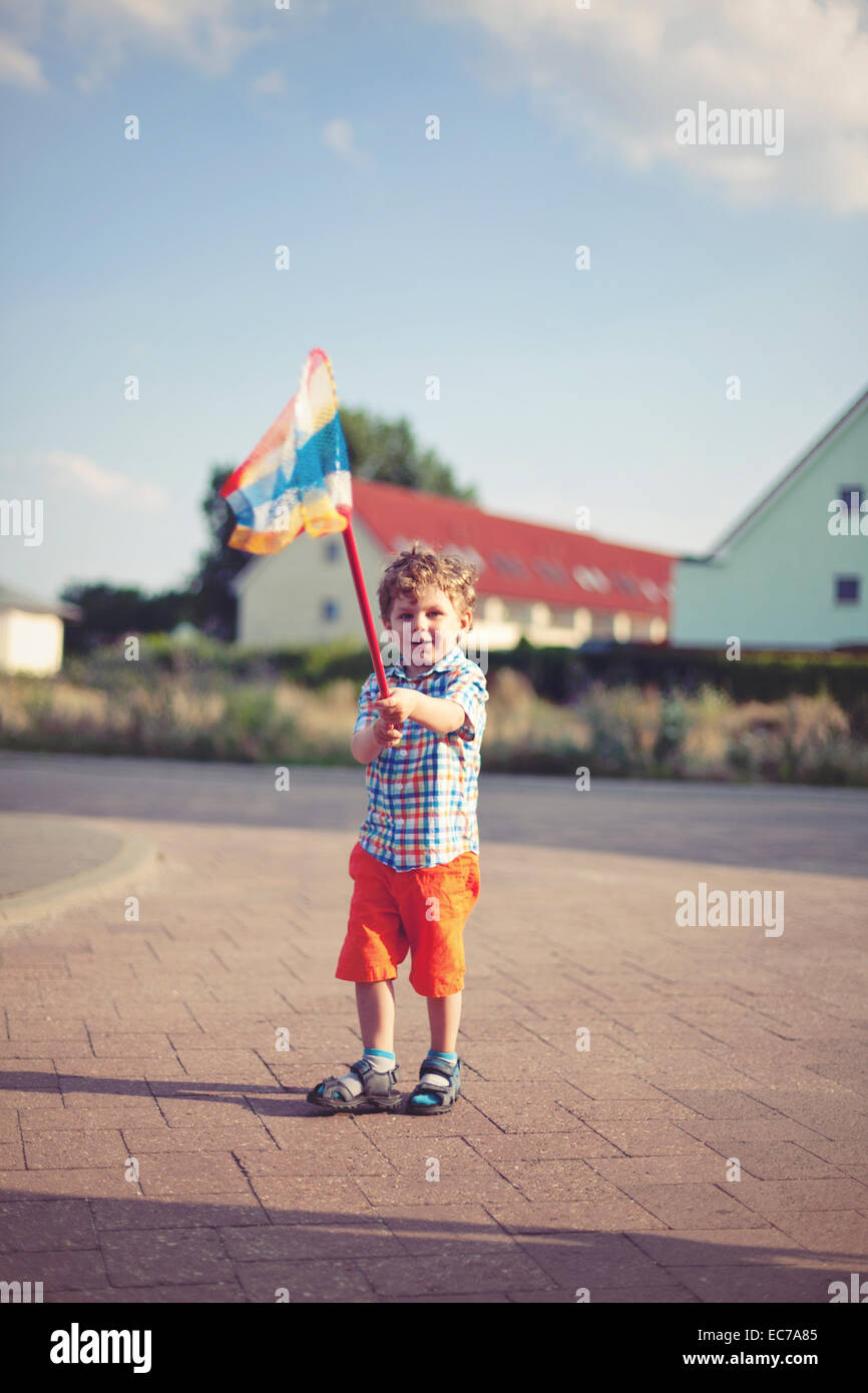 Happy little boy with net Stock Photo - Alamy