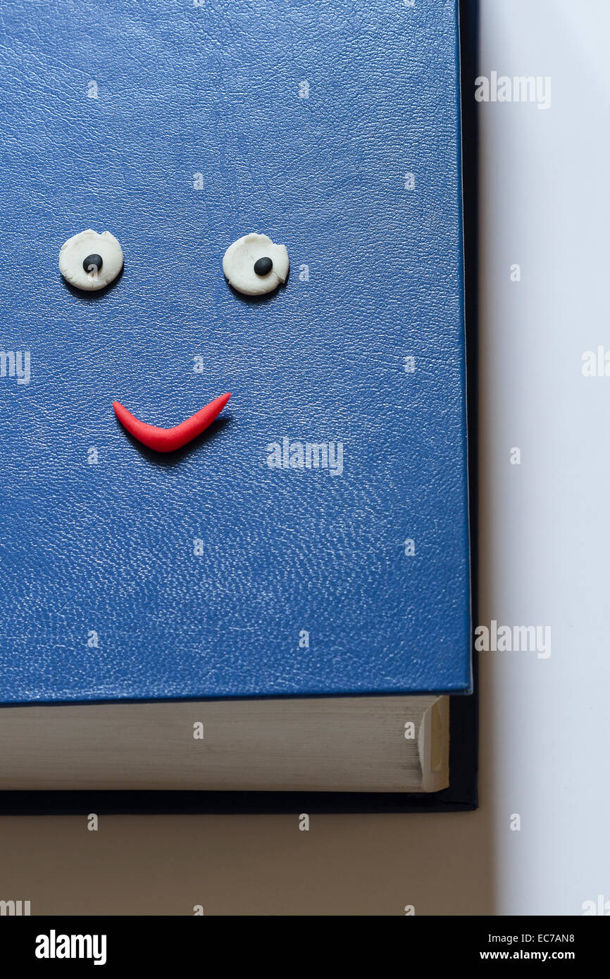 Book with face Stock Photo - Alamy