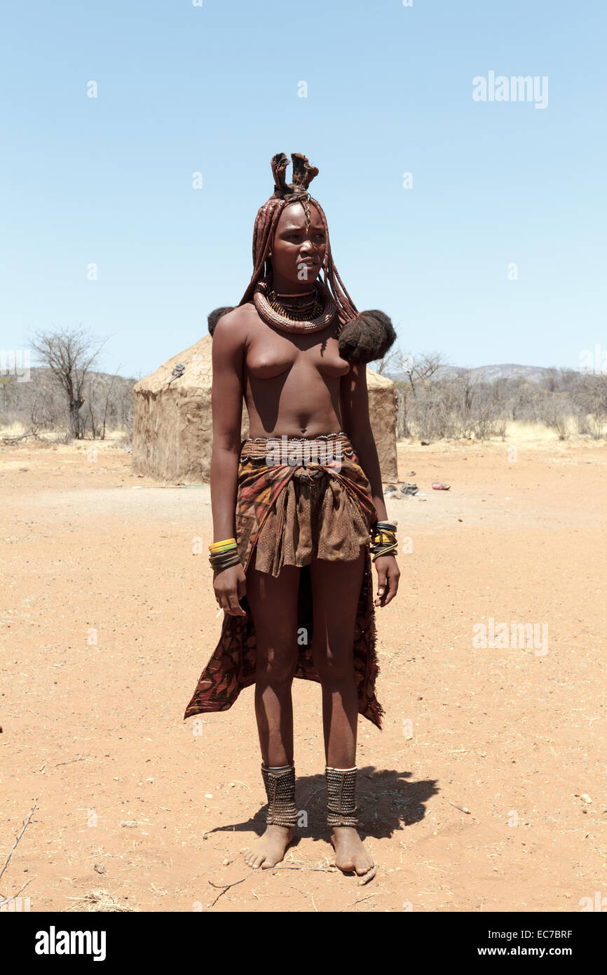 NAMIBIA, KAMANJAB, OCTOBER 10: Himba tribe woman with ornaments on the neck, in the village of ...