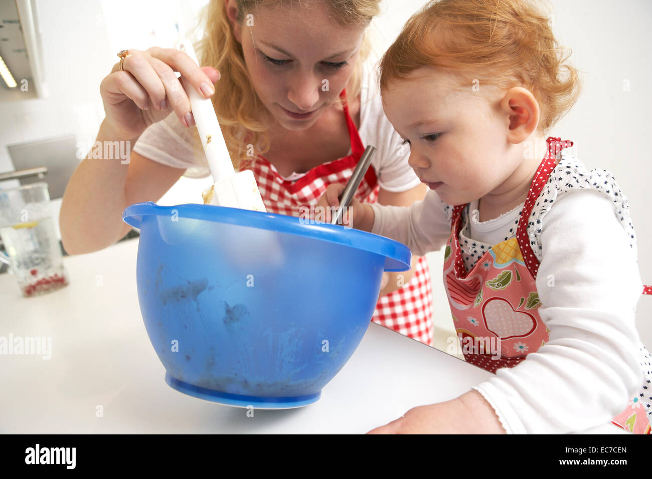 Two girls baking cake in hi-res stock photography and images - Alamy
