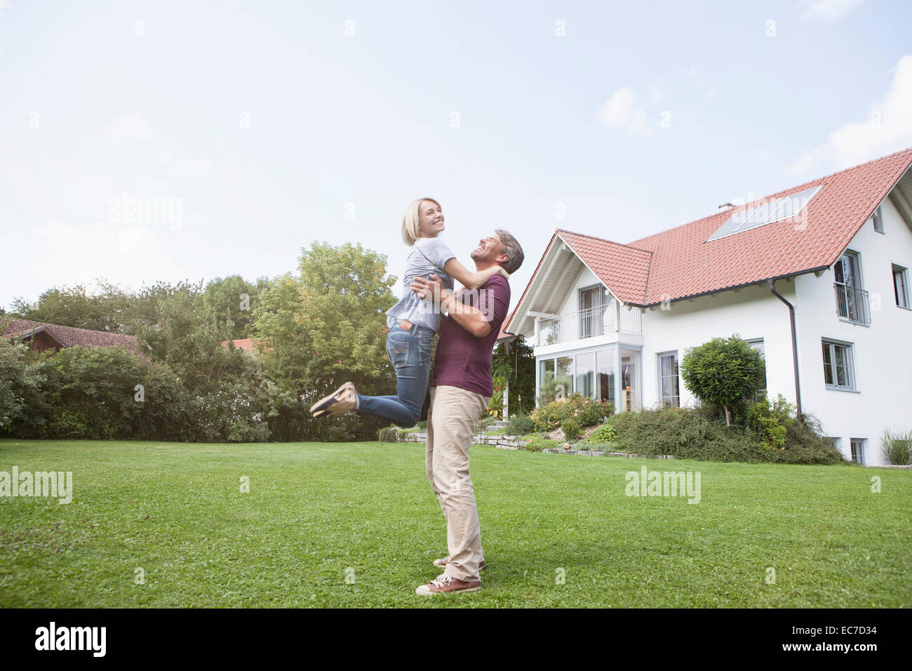 Man Lifting Up Woman High Resolution Stock Photography and Images - Alamy