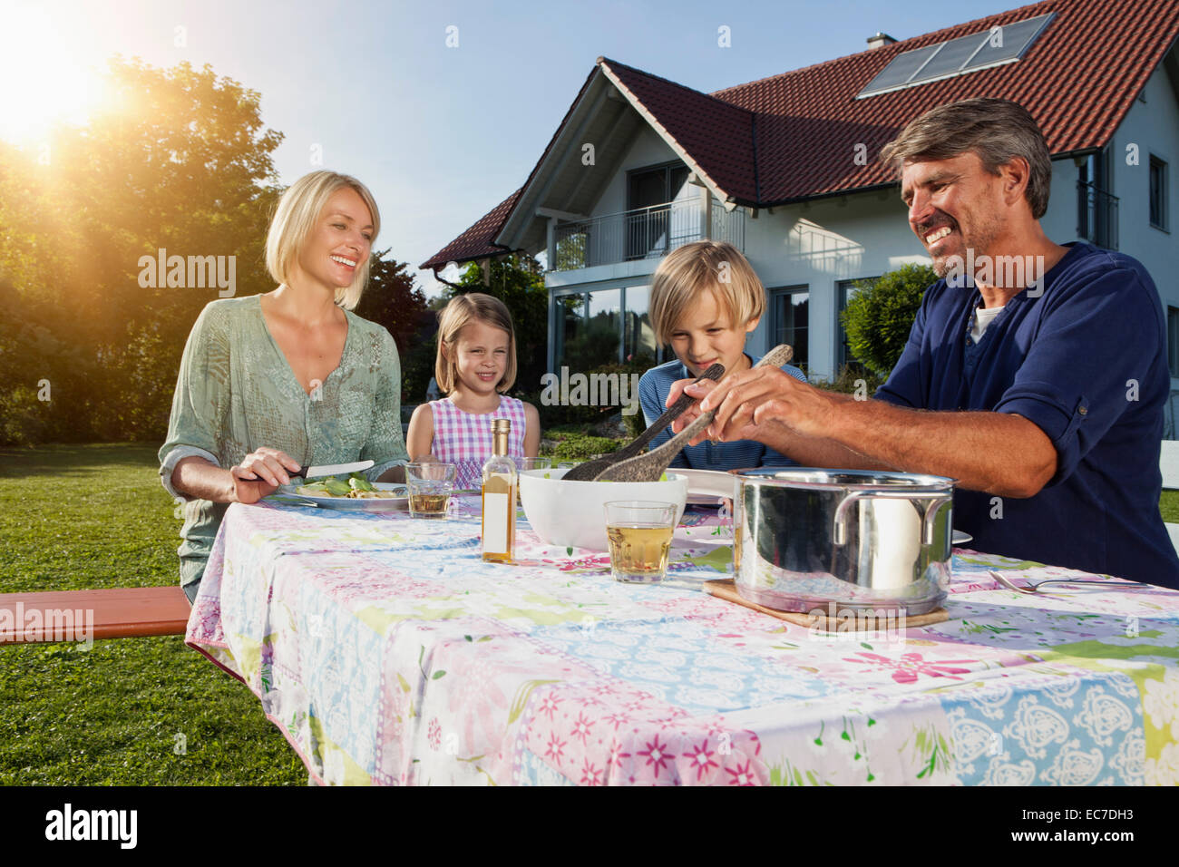 Family having lunch in garden Stock Photo - Alamy