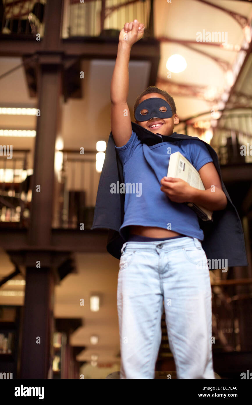 Child in costume holding book hi-res stock photography and images - Alamy