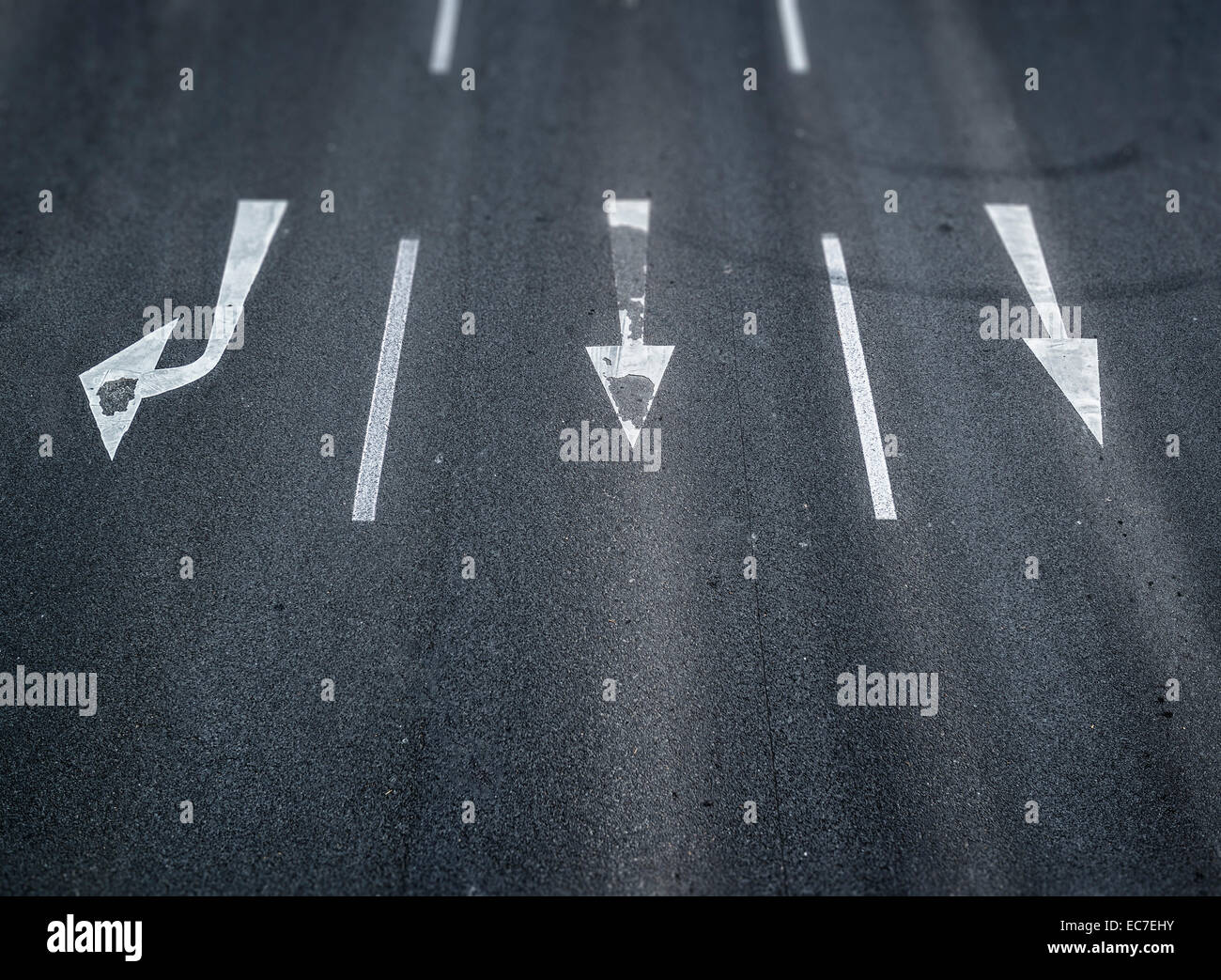 Arrow signs on a road Stock Photo - Alamy