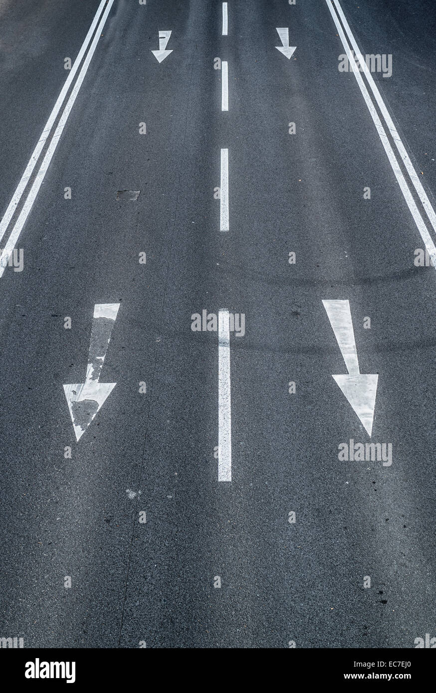 Arrow signs on a road Stock Photo - Alamy