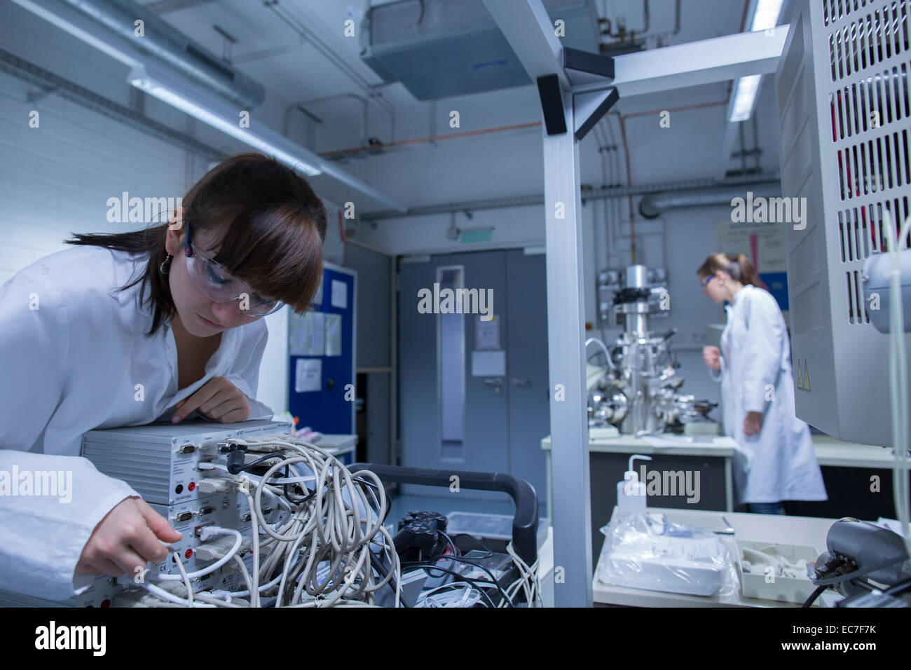 Two female technicans working in a technical laboratory Stock Photo - Alamy