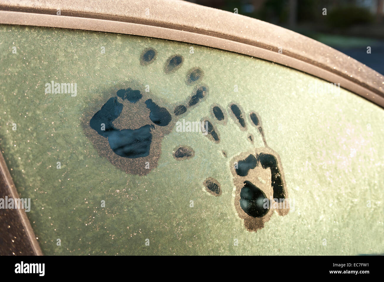 hand print like foot prints melted frost on window to car idea of ...