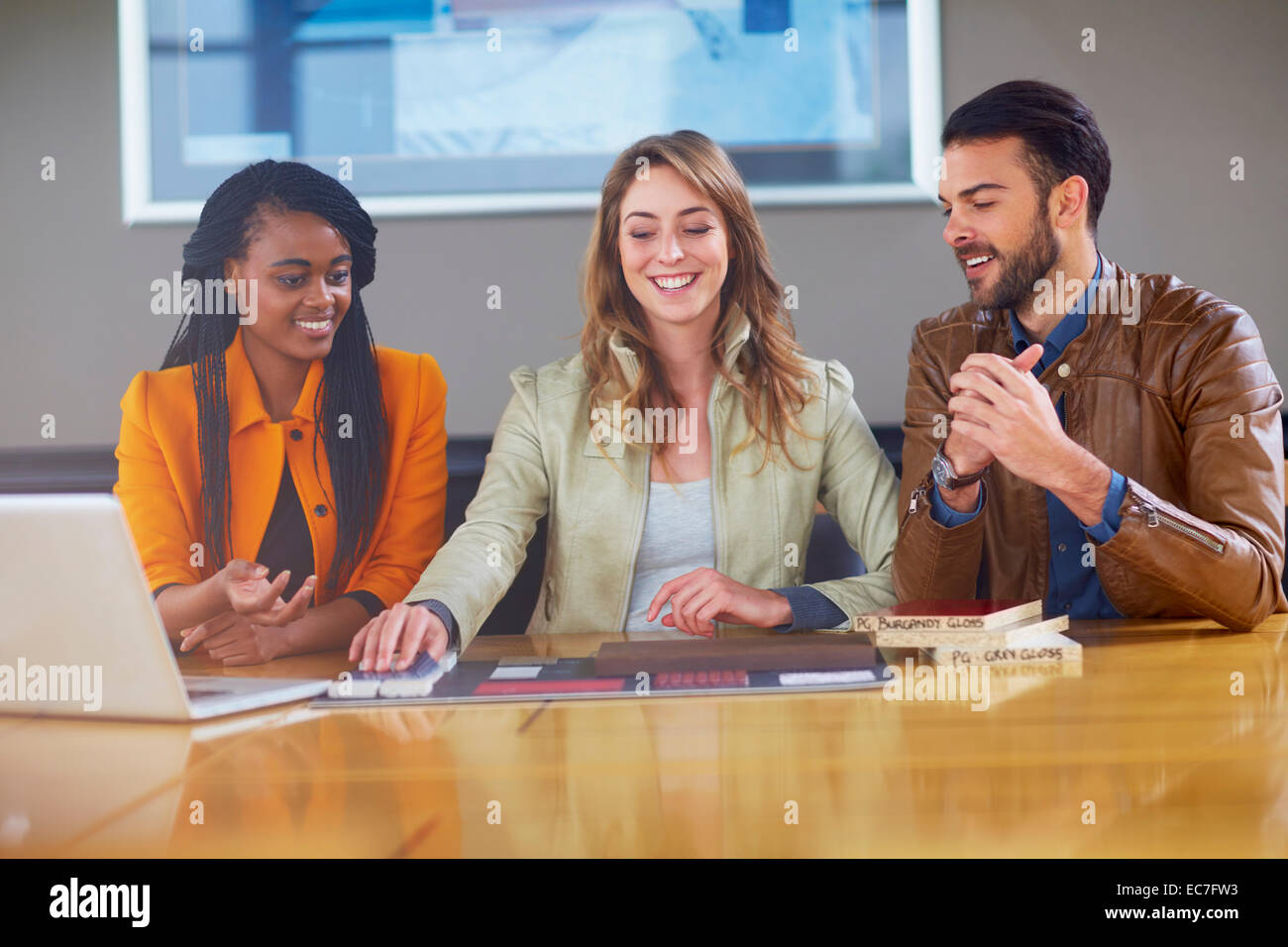 Three colleagues at business meeting Stock Photo - Alamy
