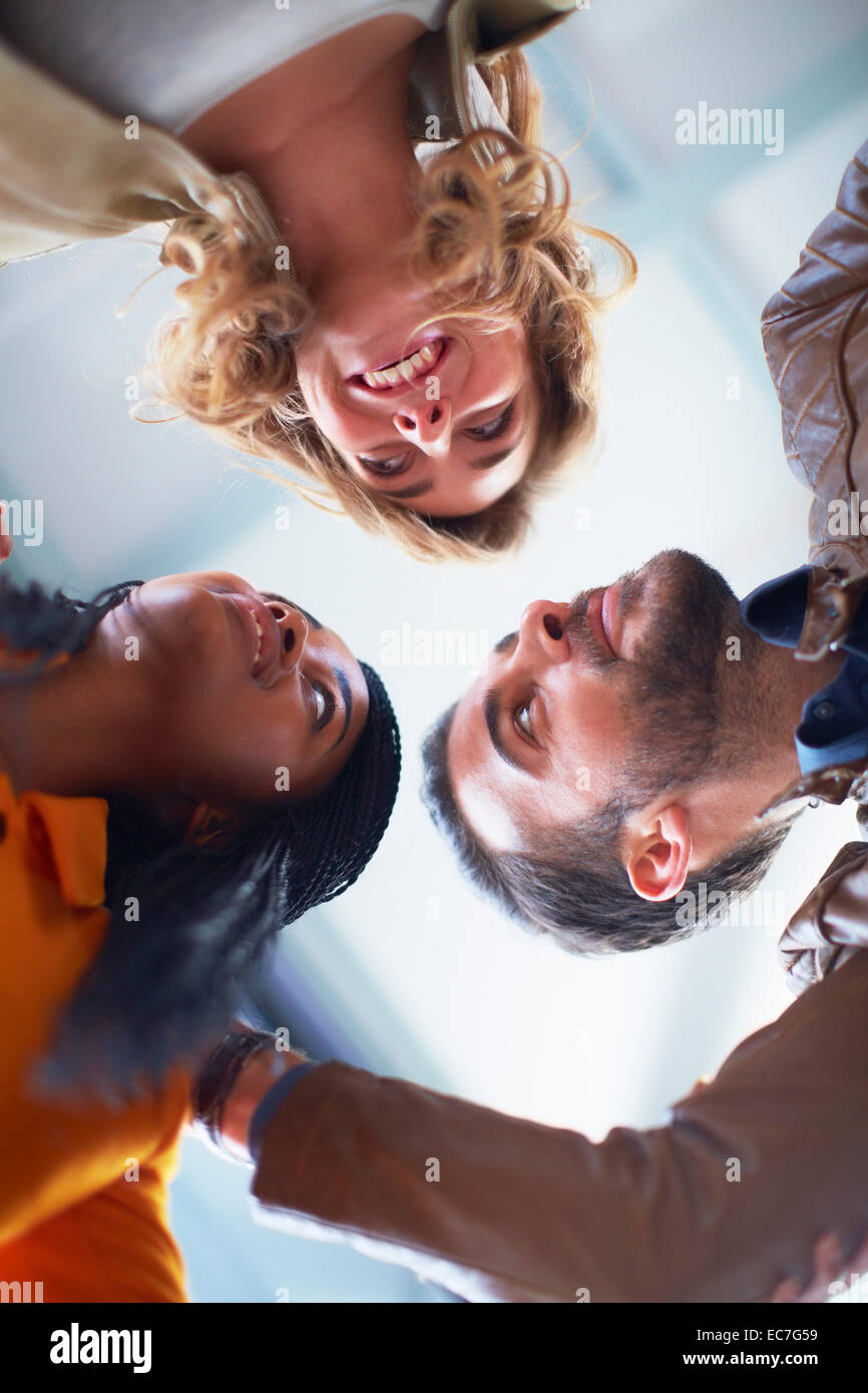 Portrait of three creative people, view from below Stock Photo - Alamy