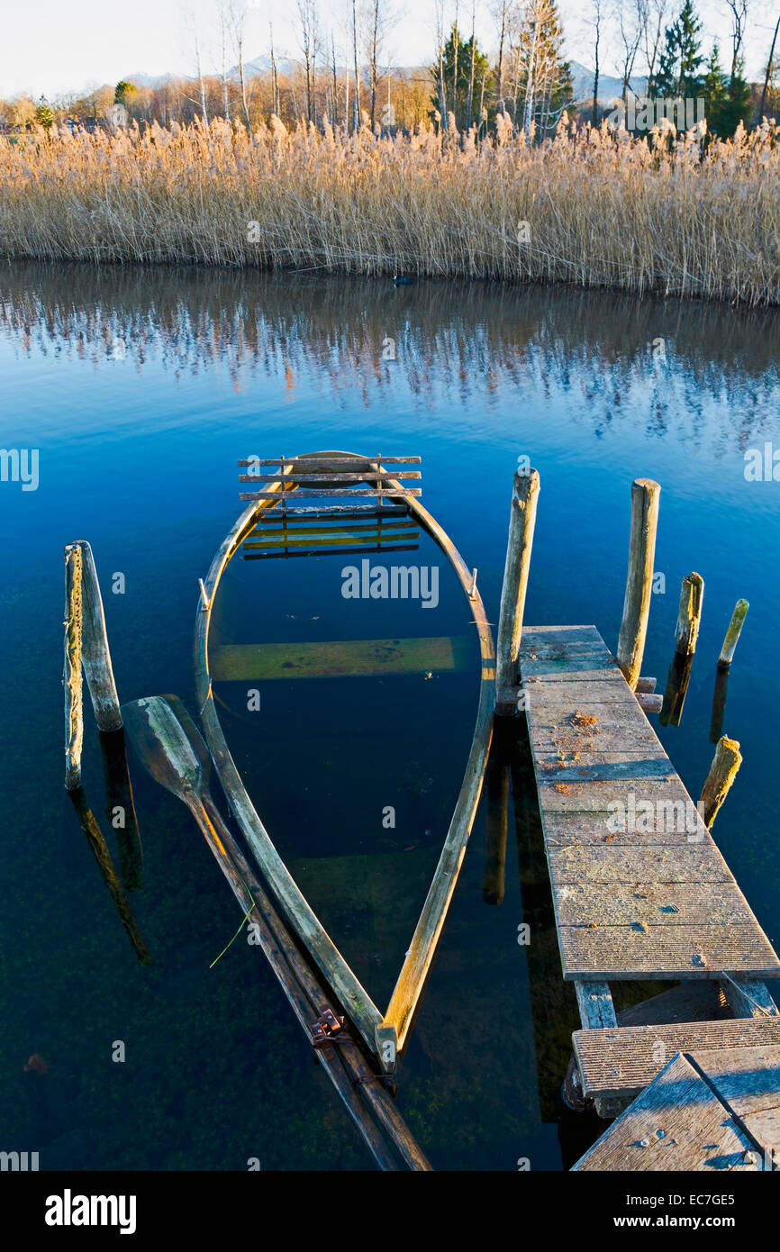 Germany, Bavaria, Upper Bavaria, Lake Staffelsee, sunken rowing boat at ...