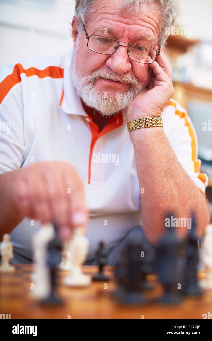 Senior man playing chess Stock Photo - Alamy