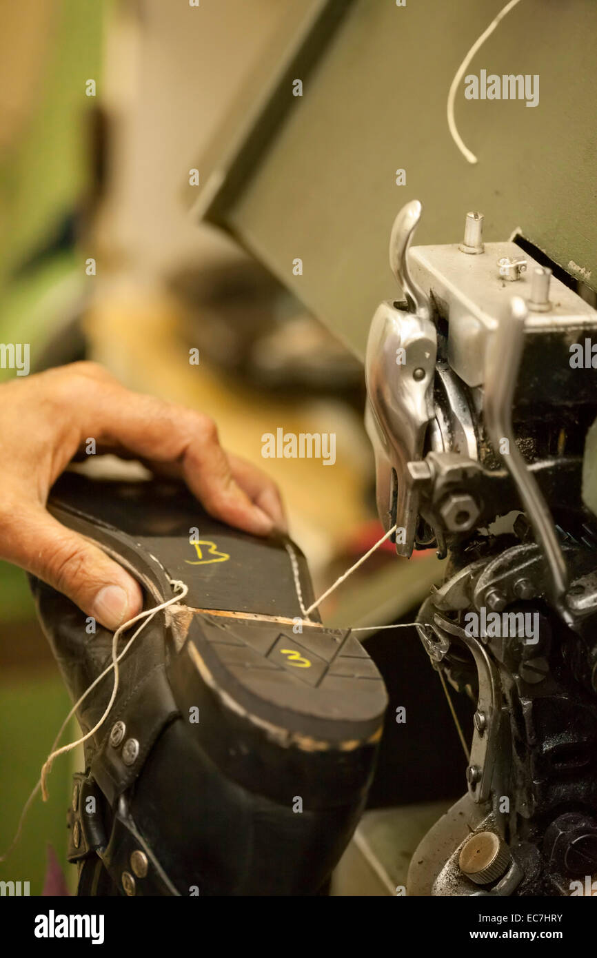 Cobbler's hand at work Stock Photo - Alamy