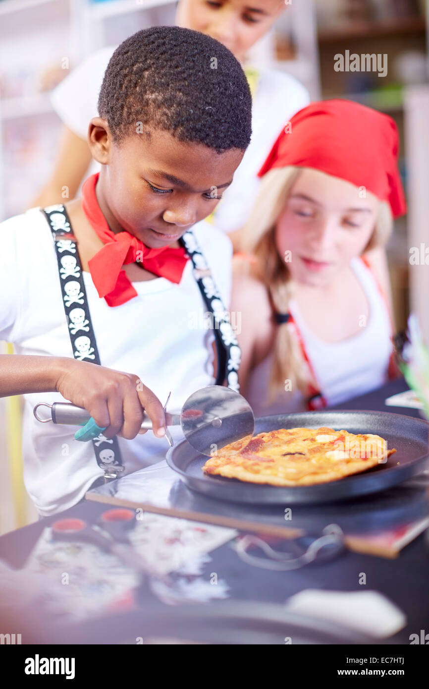 Children dressed up as pirates eating pizza on a party Stock Photo - Alamy