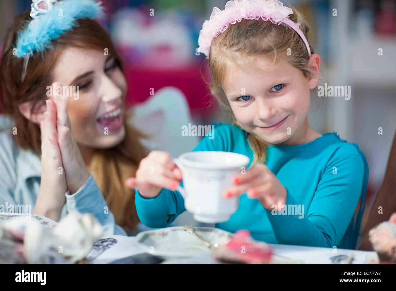 Girl and teenage girl on a tea party Stock Photo - Alamy