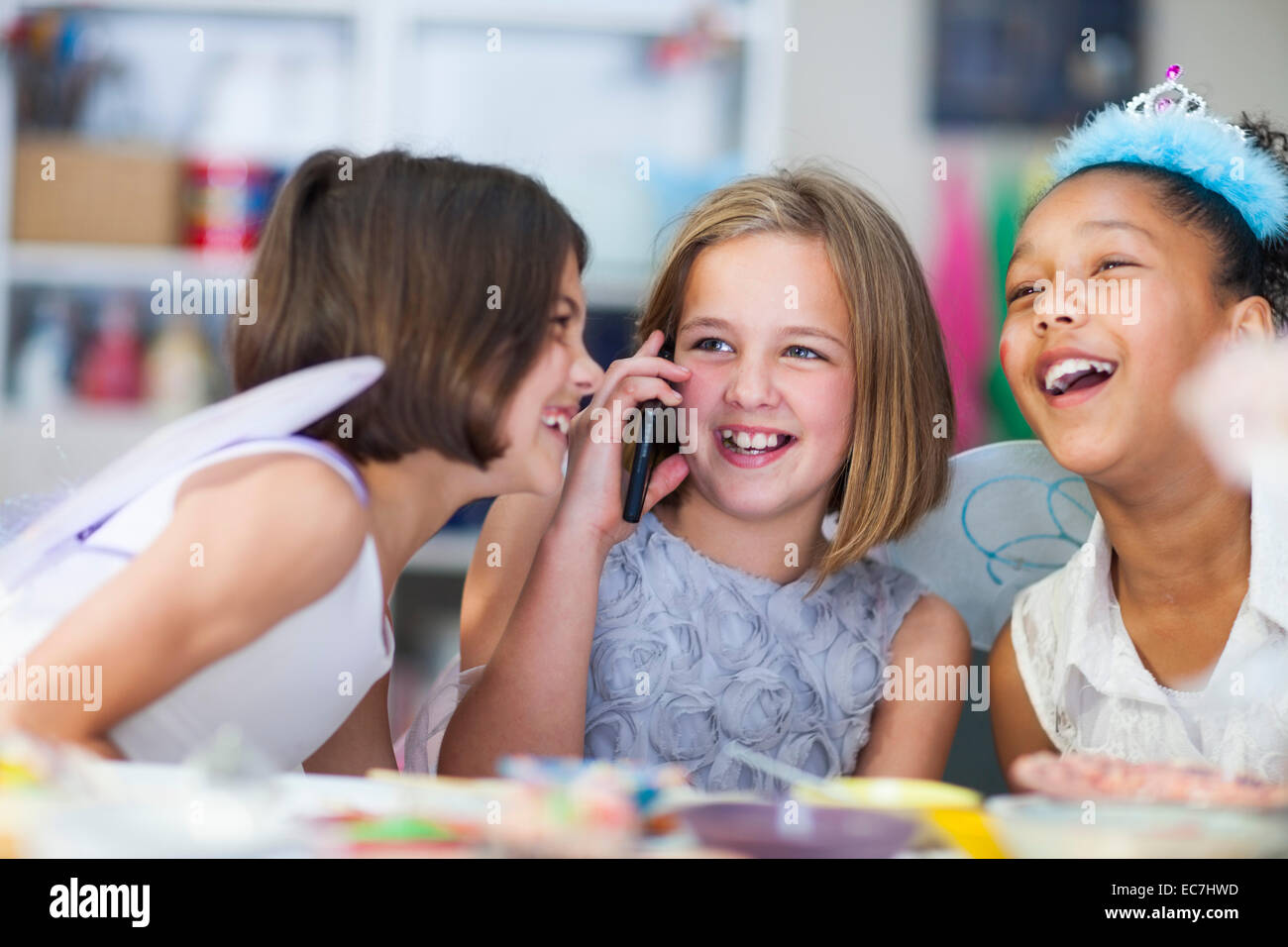 Girls with cell phone on a birthday party Stock Photo - Alamy