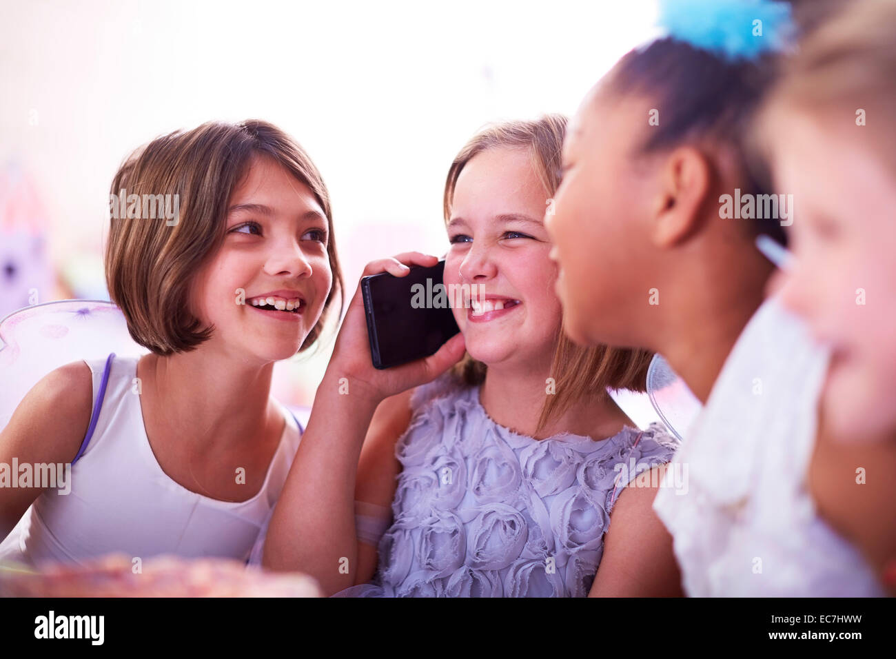 Girls with cell phone on a birthday party Stock Photo - Alamy