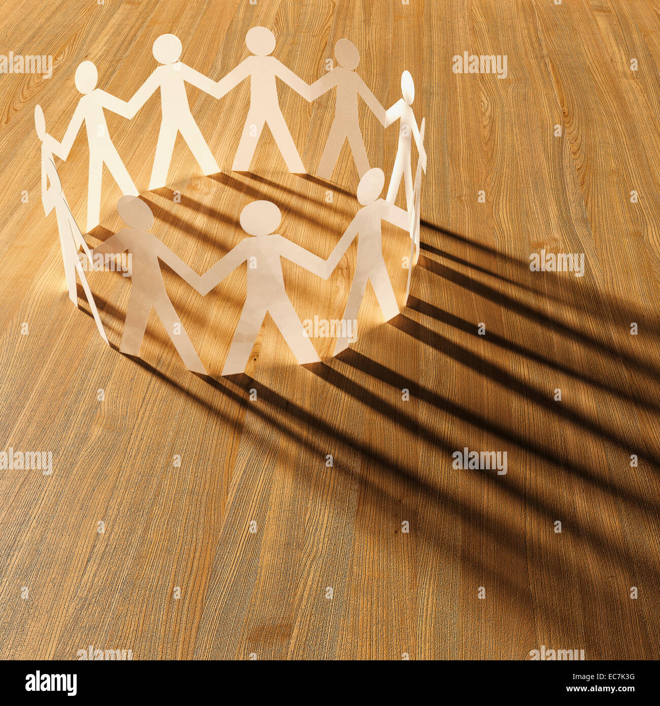 Circle of white cardboard men on wood, 3D Rendering Stock Photo - Alamy