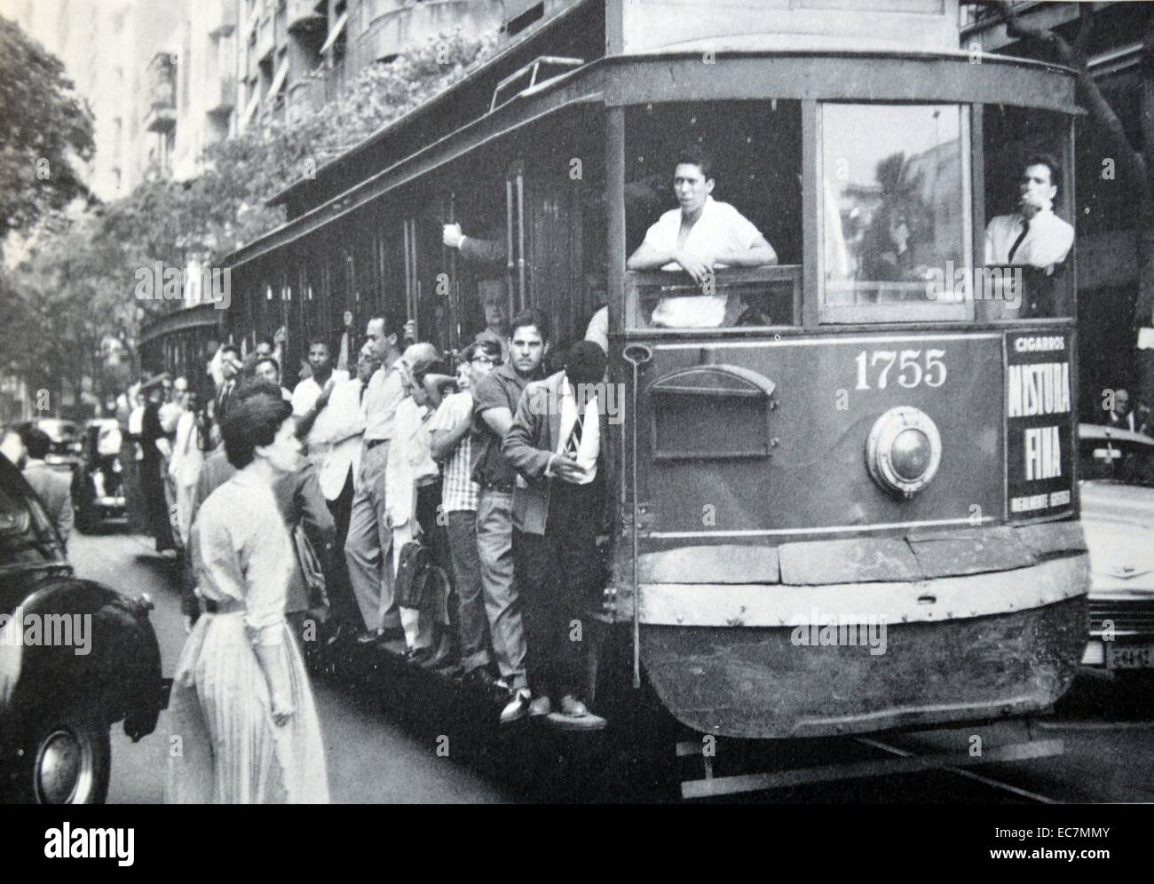 Busy street scene in Rio de Janeiro, Brazil as people crowd a tram ...
