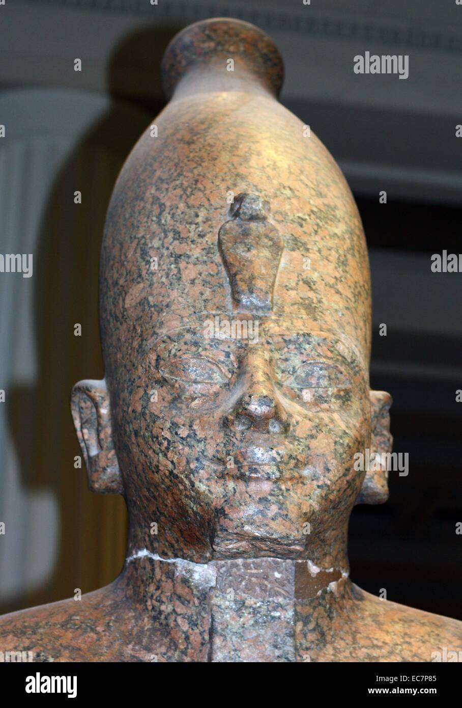 Red granite standing figure of a king, 18th dynasty, about 1450BC. From ...