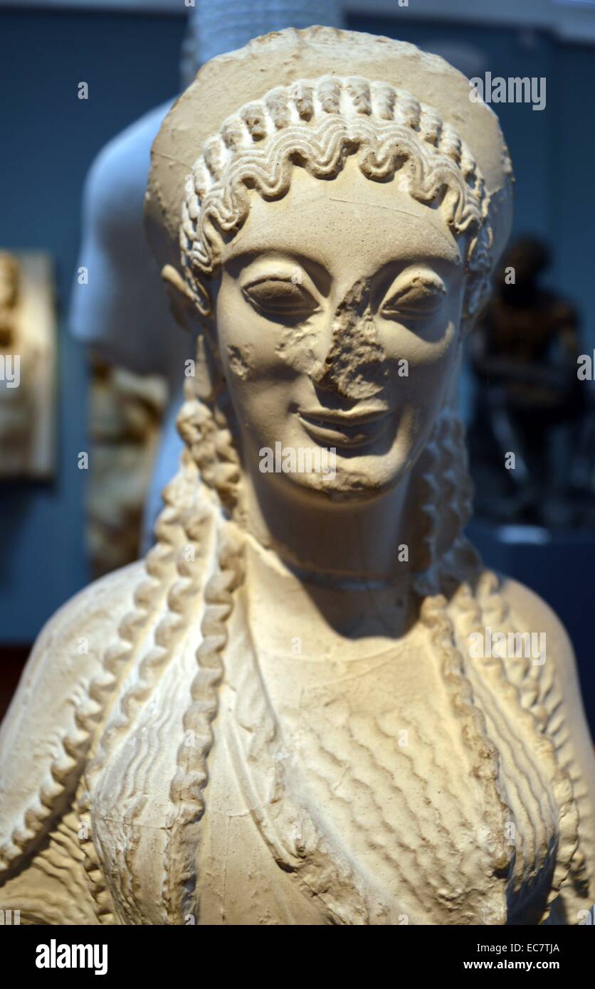 Kore 675 from Athenian Acropolis, c 500 BC. The young woman wears an ...