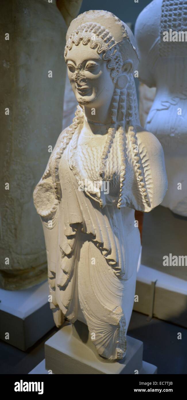 Kore 675 from Athenian Acropolis, c 500 BC. The young woman wears an ...
