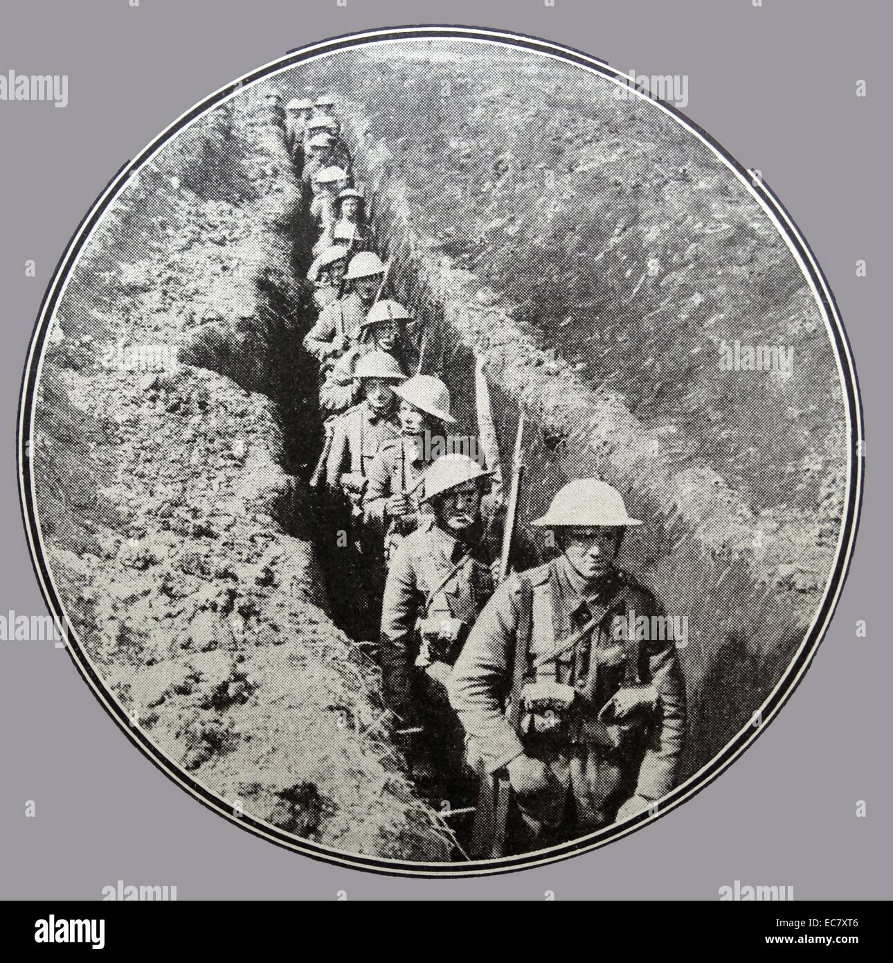 British soldiers pass through a link trench joining front line ...