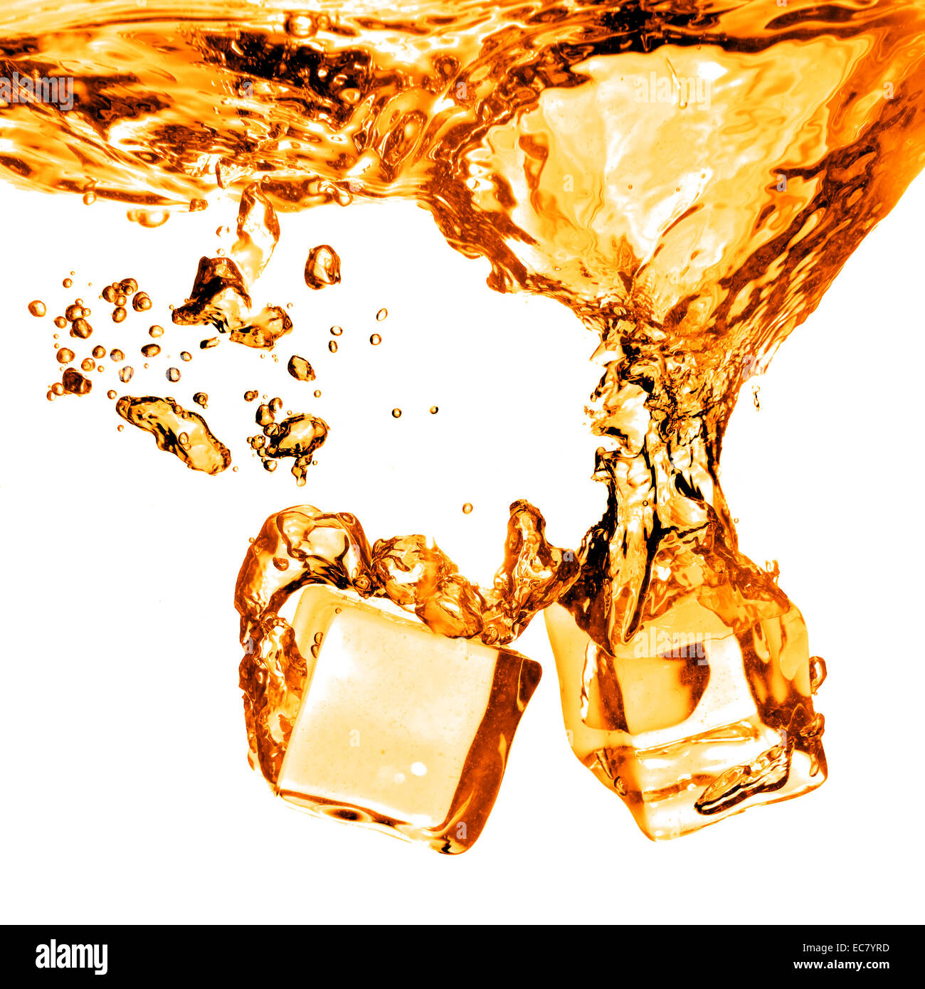 ice cubes dropped into orange water with splash isolated on white Stock Photo - Alamy