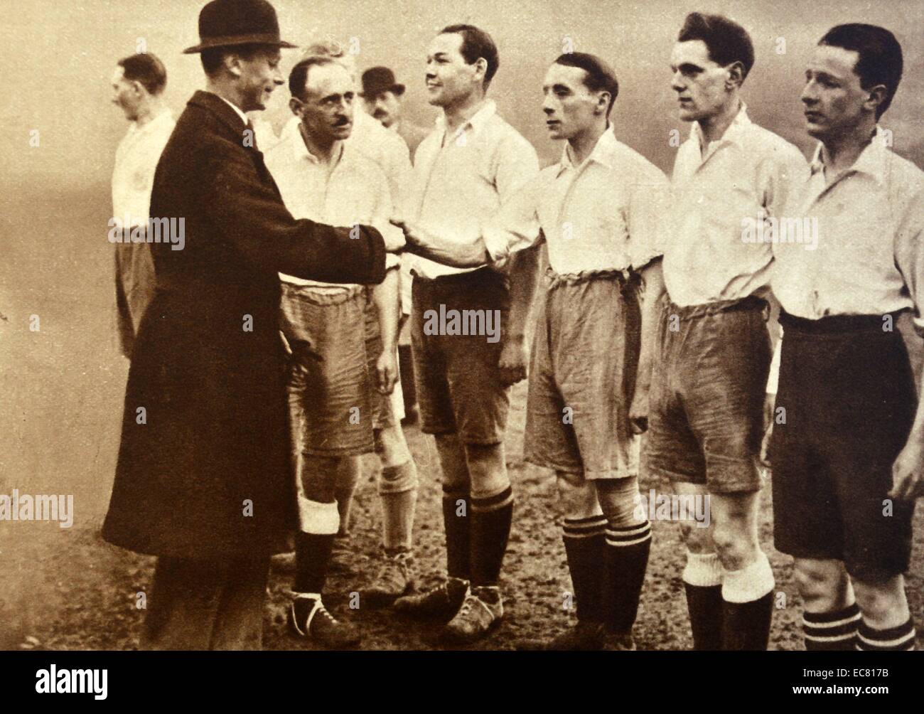 The Duke of York, later King George VI greets players at a football ...